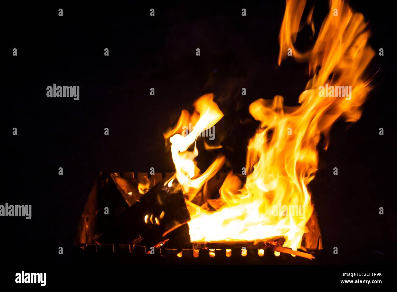 Fire on a dark background. Fire from firewood close up. Flaming burning ...