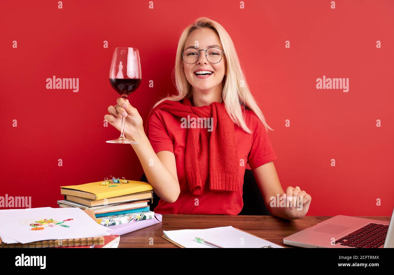 amazing caucasian female drink red wine at work place, she is ...