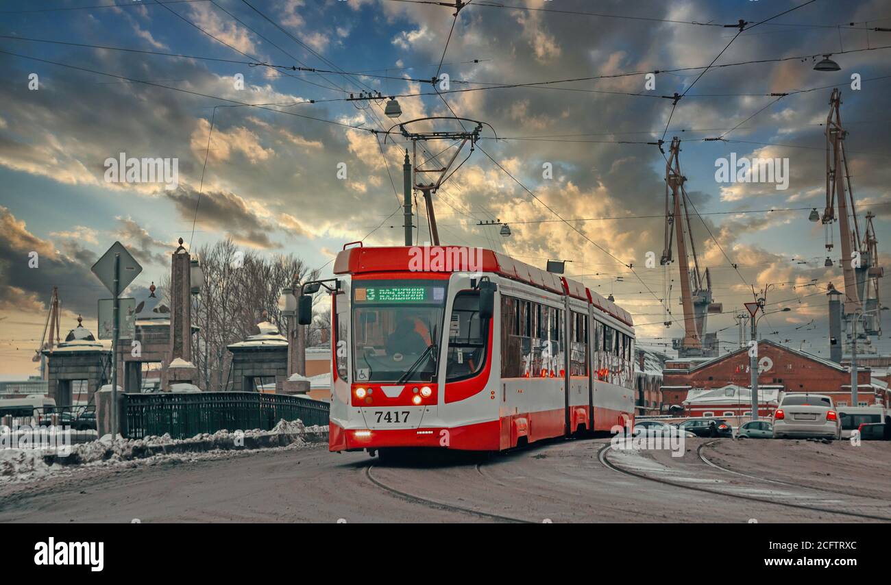 Modern city tram crossing bridge in St. Petersburg. Public ...