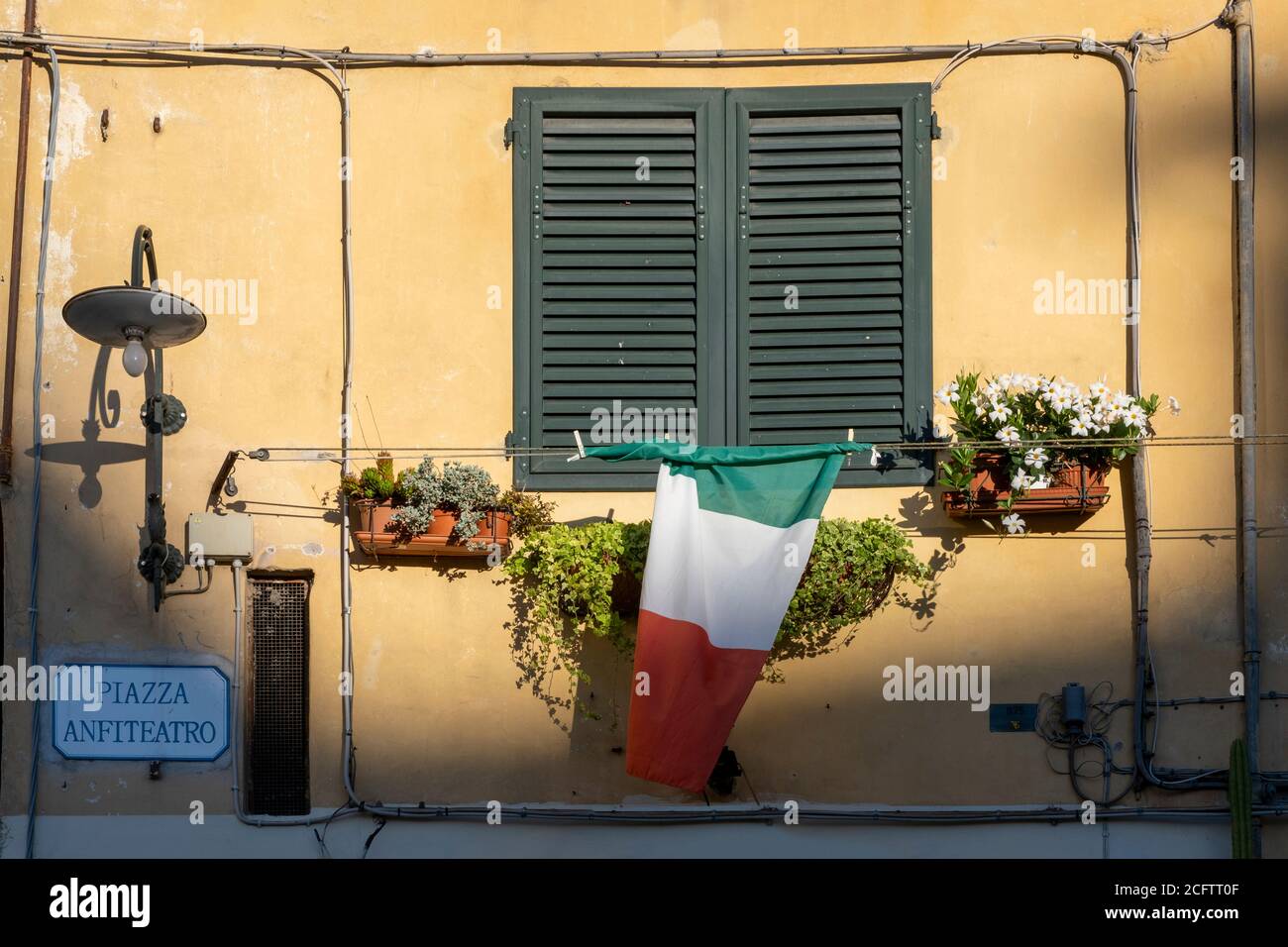 Italian Window with Wooden Shutters in a plastered wall Stock Photo - Alamy