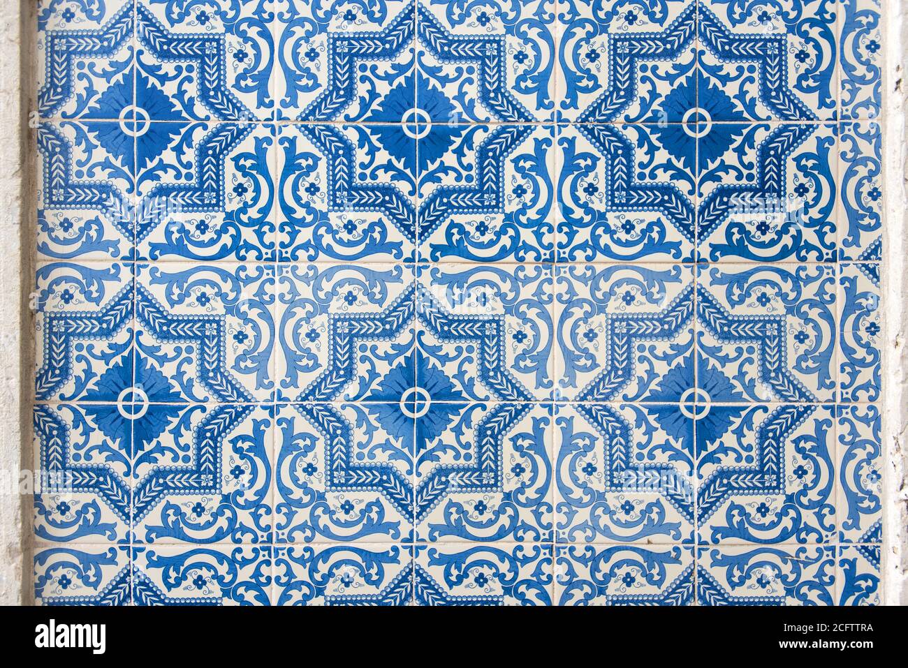 Old wall with traditional Portuguese decor tiles azulezhu in blue tones ...