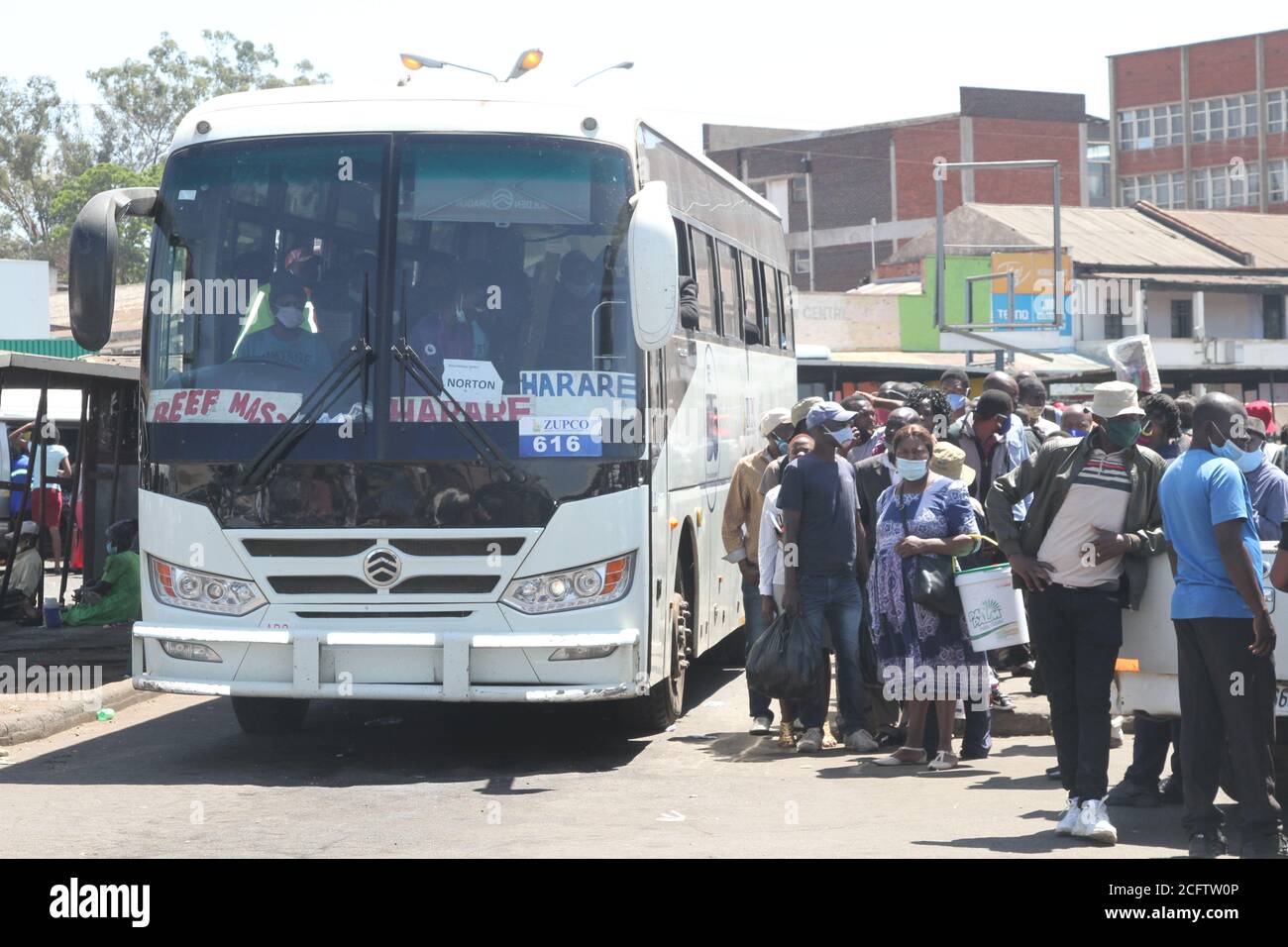 Harare, Zimbabwe. 7th Sep, 2020. People line up to take a bus in Harare, Zimbabwe, on Sept. 7 ...