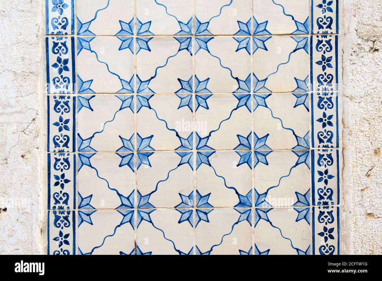 Old wall with traditional Portuguese decor tiles azulezhu in blue tones ...