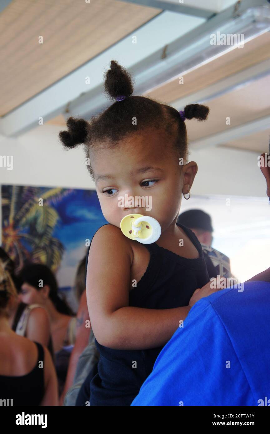 Seychelles adorable little girl in the arms of the father. Sweet cute ...