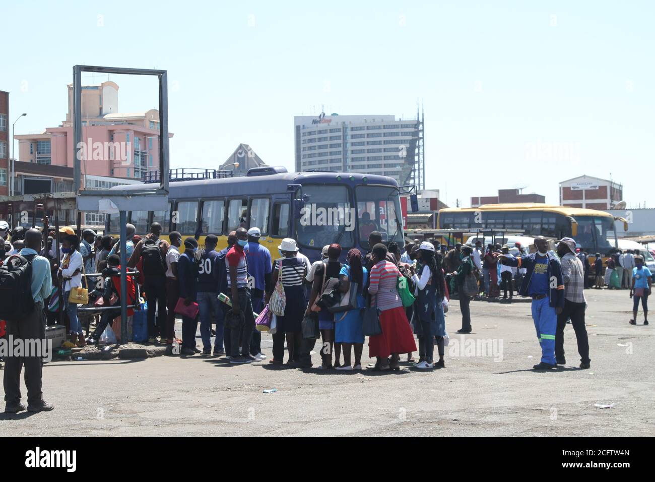 Harare, Zimbabwe. 7th Sep, 2020. People line up to take buses at Market ...