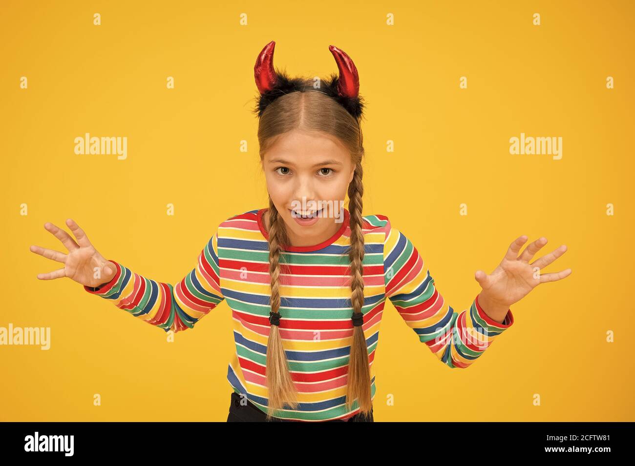 Preparing for party. Small demon. Playful demon girl. Little demon ...