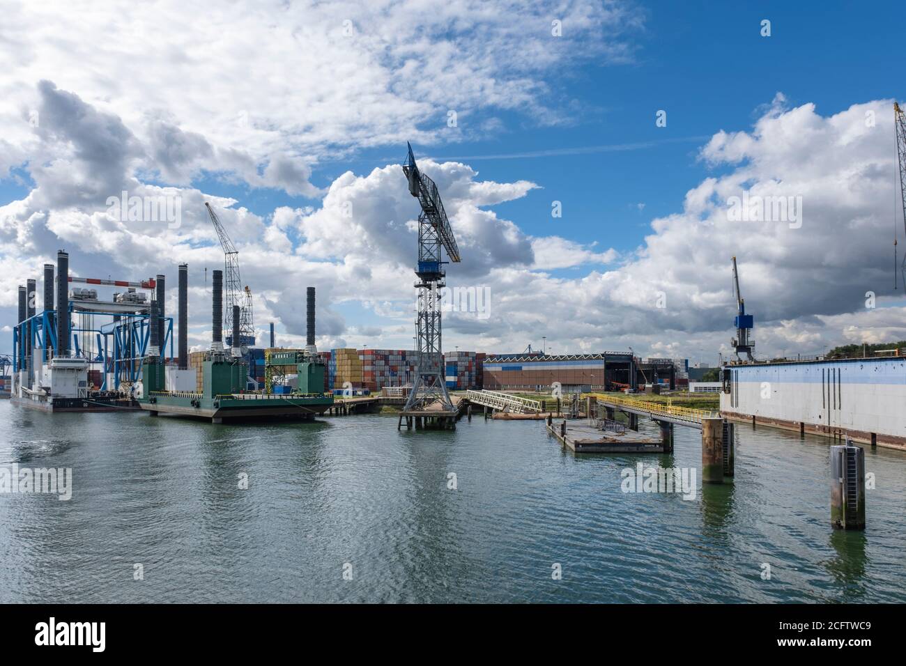 Container ships moored at a container terminal in the Port of Rotterdam ...
