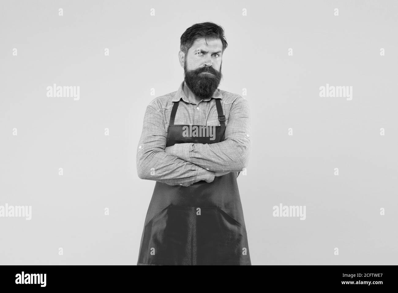 commercial kitchen. Entrepreneur in his modern look. bearded chef or ...