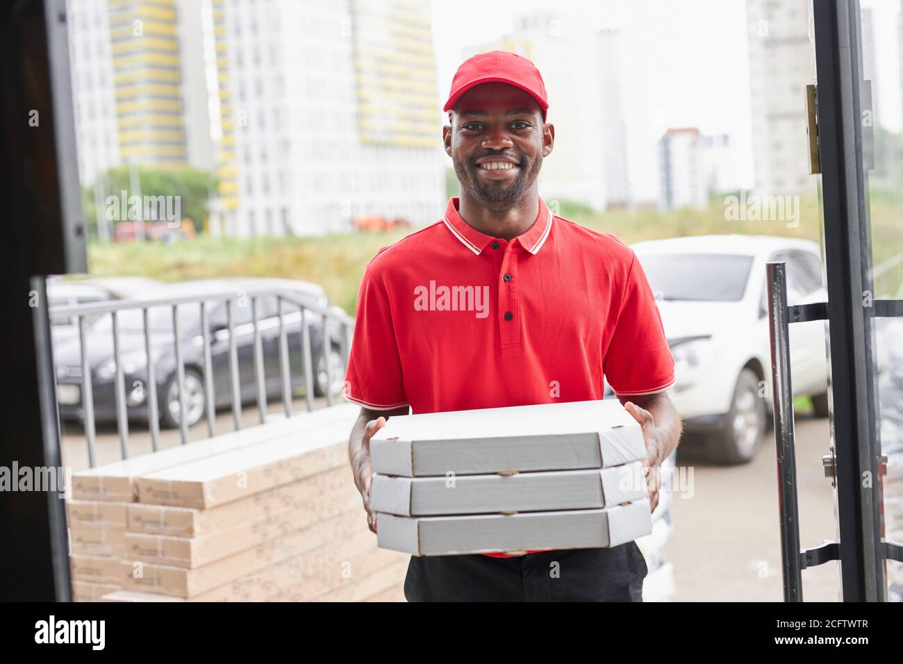Pizza delivery guy standing door hi-res stock photography and images ...