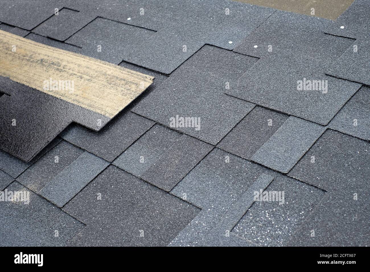 Installing asphalt roofing shingles. Installation of waterproofing ...