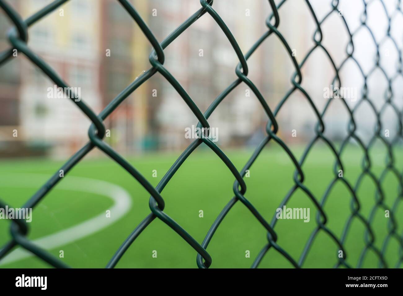 Fence netting close-up on a background of a soccer field Stock Photo ...