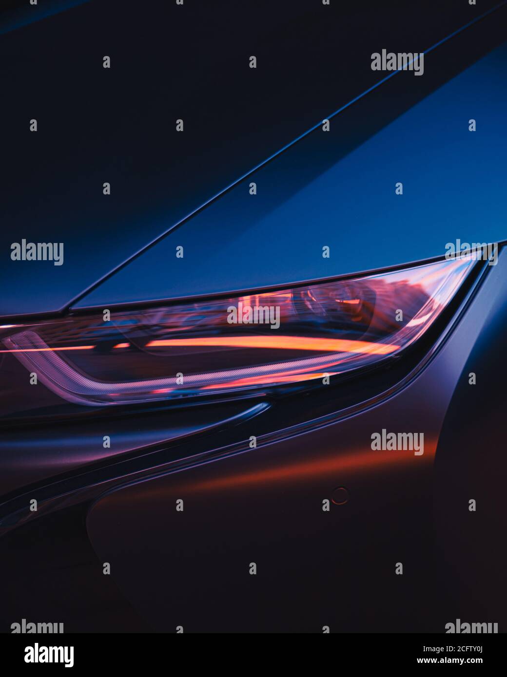Car headlight, buildings reflecting in the headlight of a car Stock ...