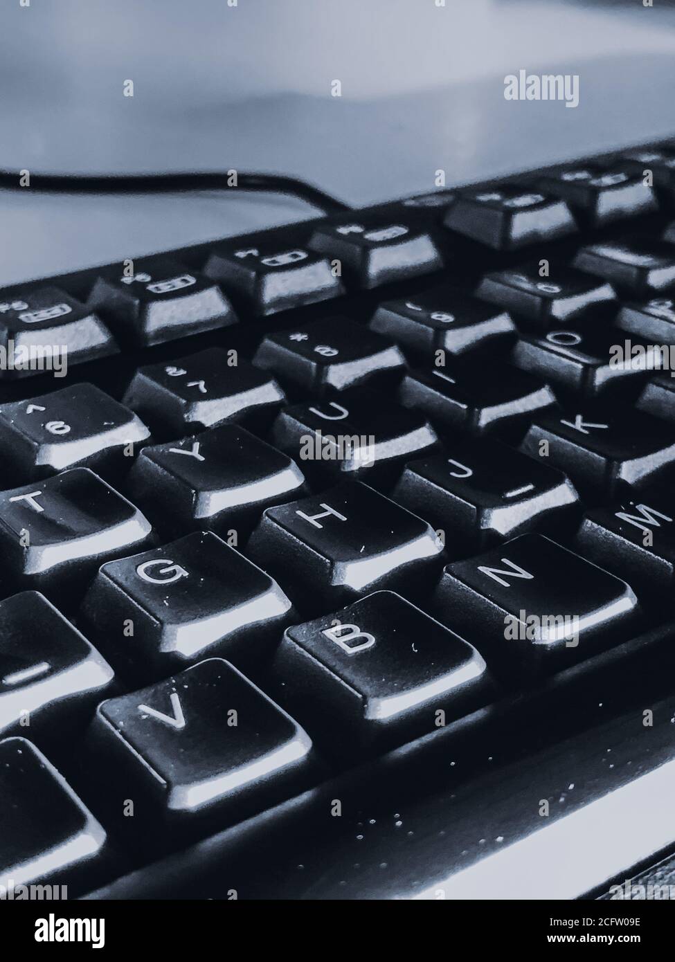 Vertical closeup shot of a black keyboard Stock Photo - Alamy