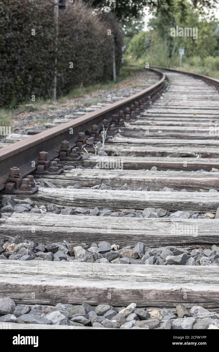 Vertical closeup shot of wooden train tracks Stock Photo - Alamy