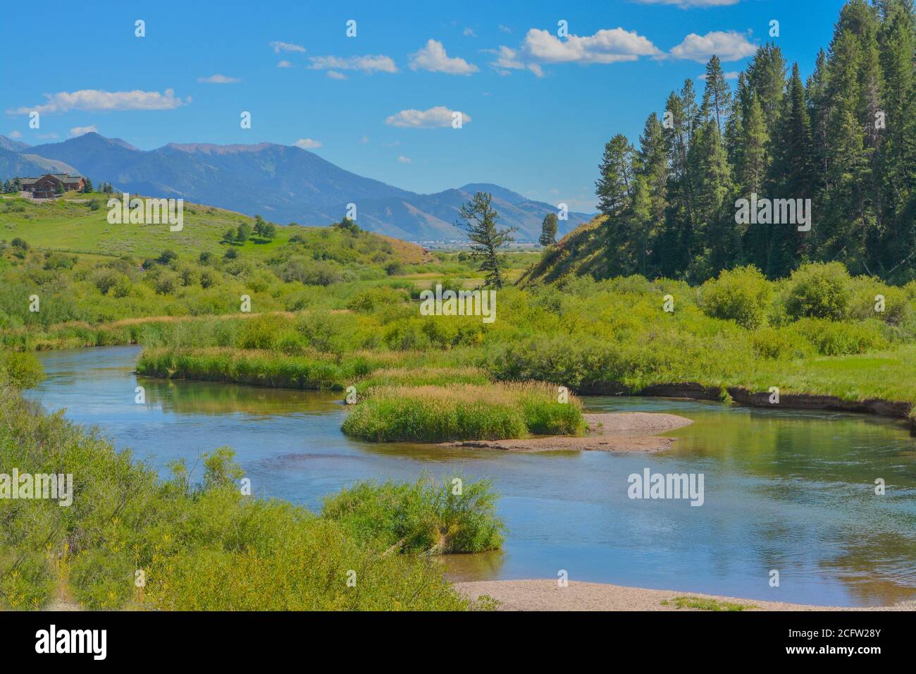 The peaceful flowing of the Snake River in the Rocky Mountains of ...