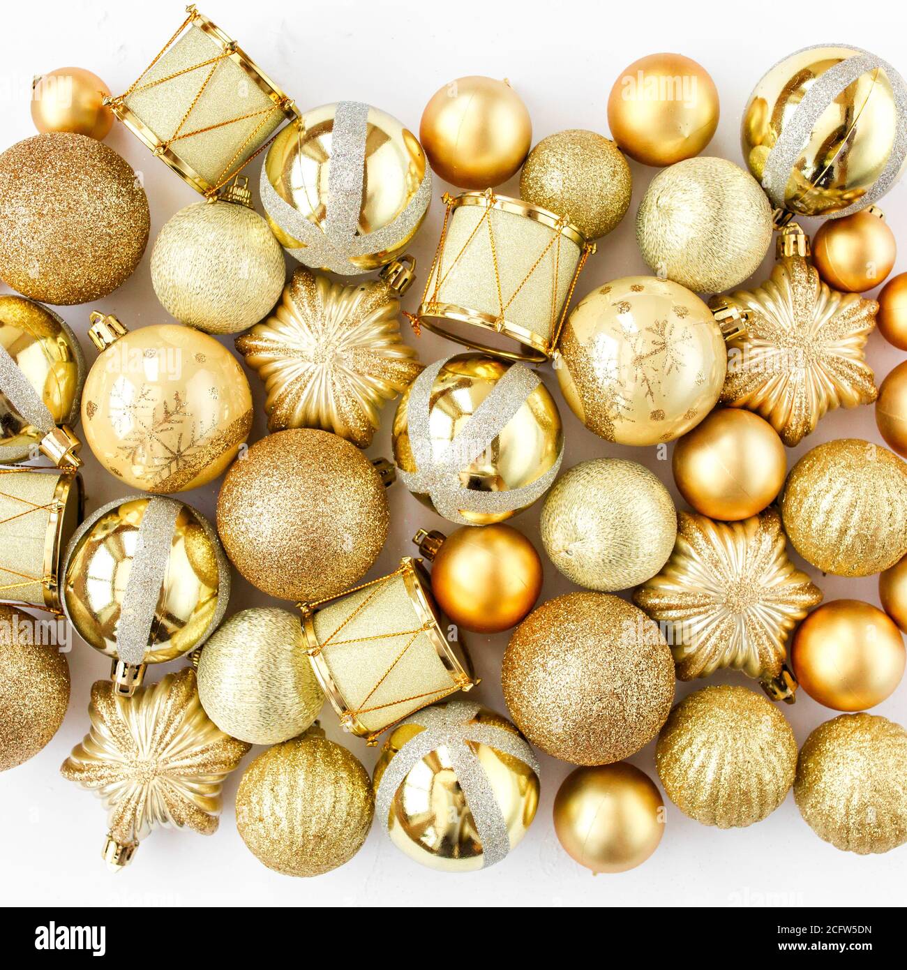 Christmas texture: golden glass christmas balls on white background ...
