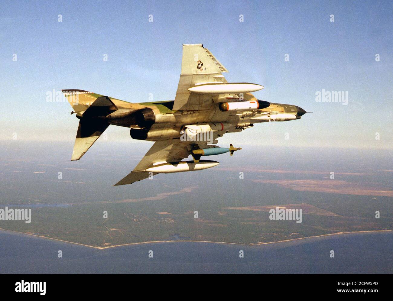 1976 - An air-to-air right underside view of an F-4E Phantom II ...