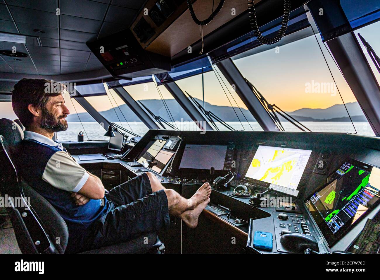 With the captain on the bridge during the Fire and Dragons Cruise of ...