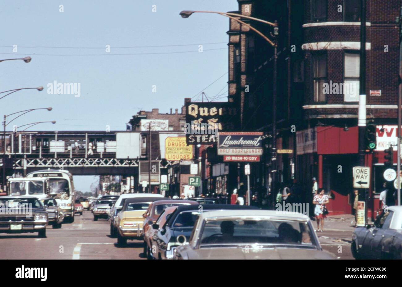 Queen of the Sea steakhouse and other businesses along a busy Chicago ...