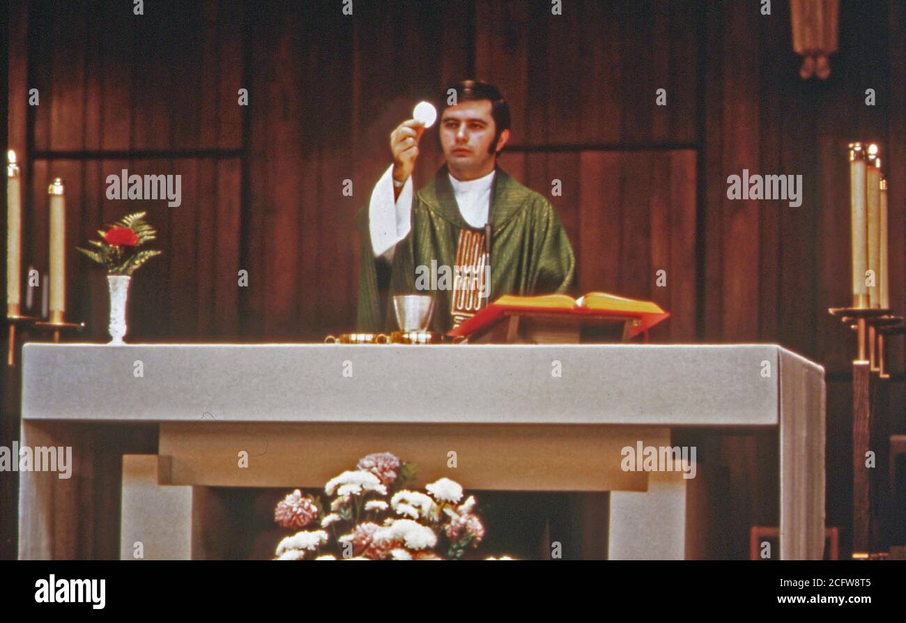 Catholic priest offers host hi-res stock photography and images - Alamy