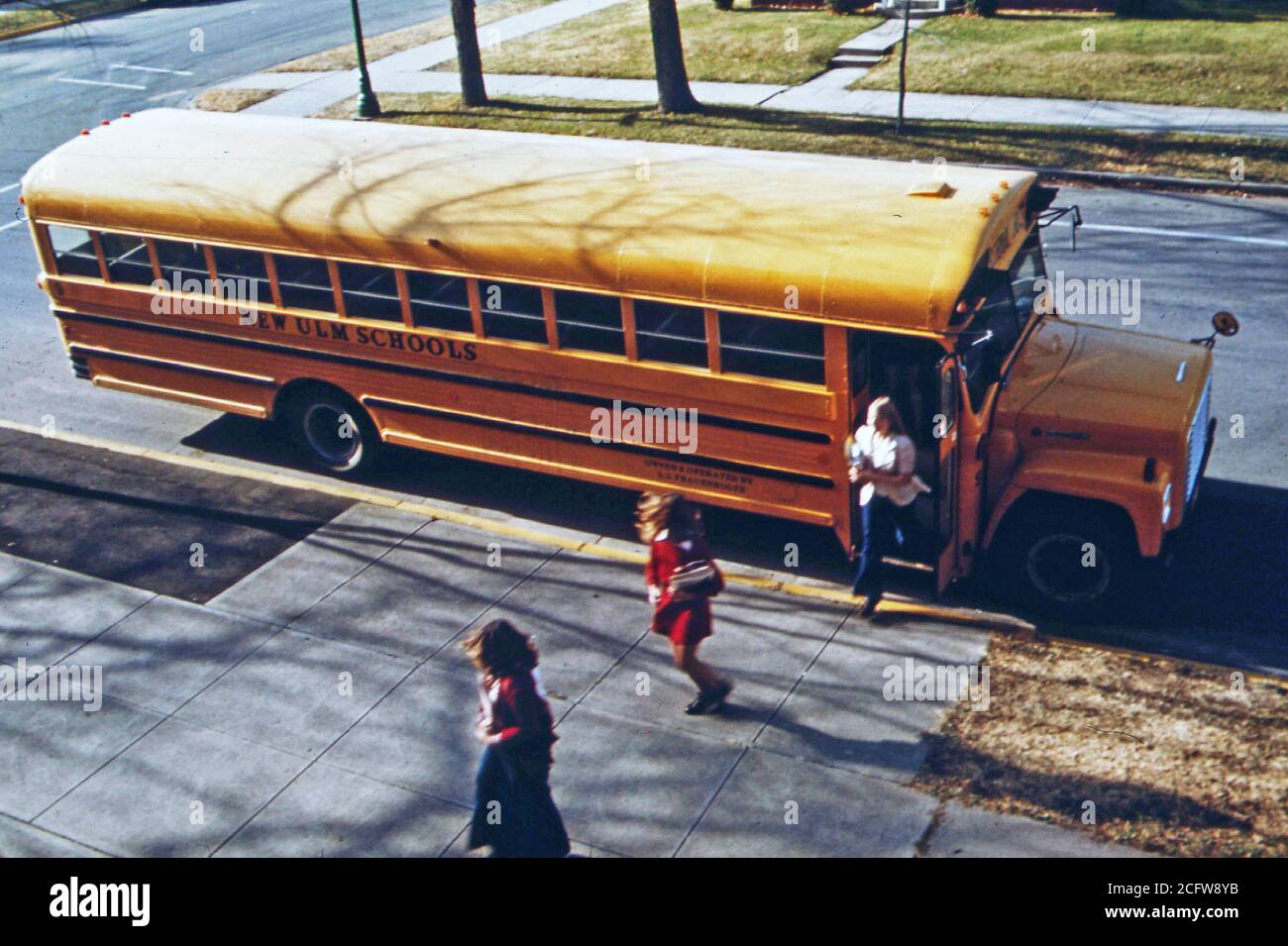 Students arrive for school in a school bus in New Ulm, Minnesota in the ...