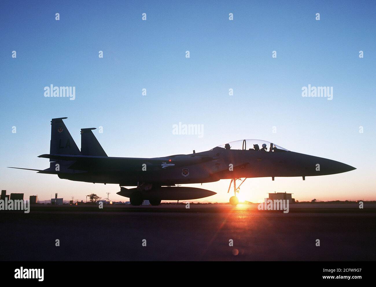 1979 - A right side view of an F-15 Eagle aircraft, silhouetted against ...