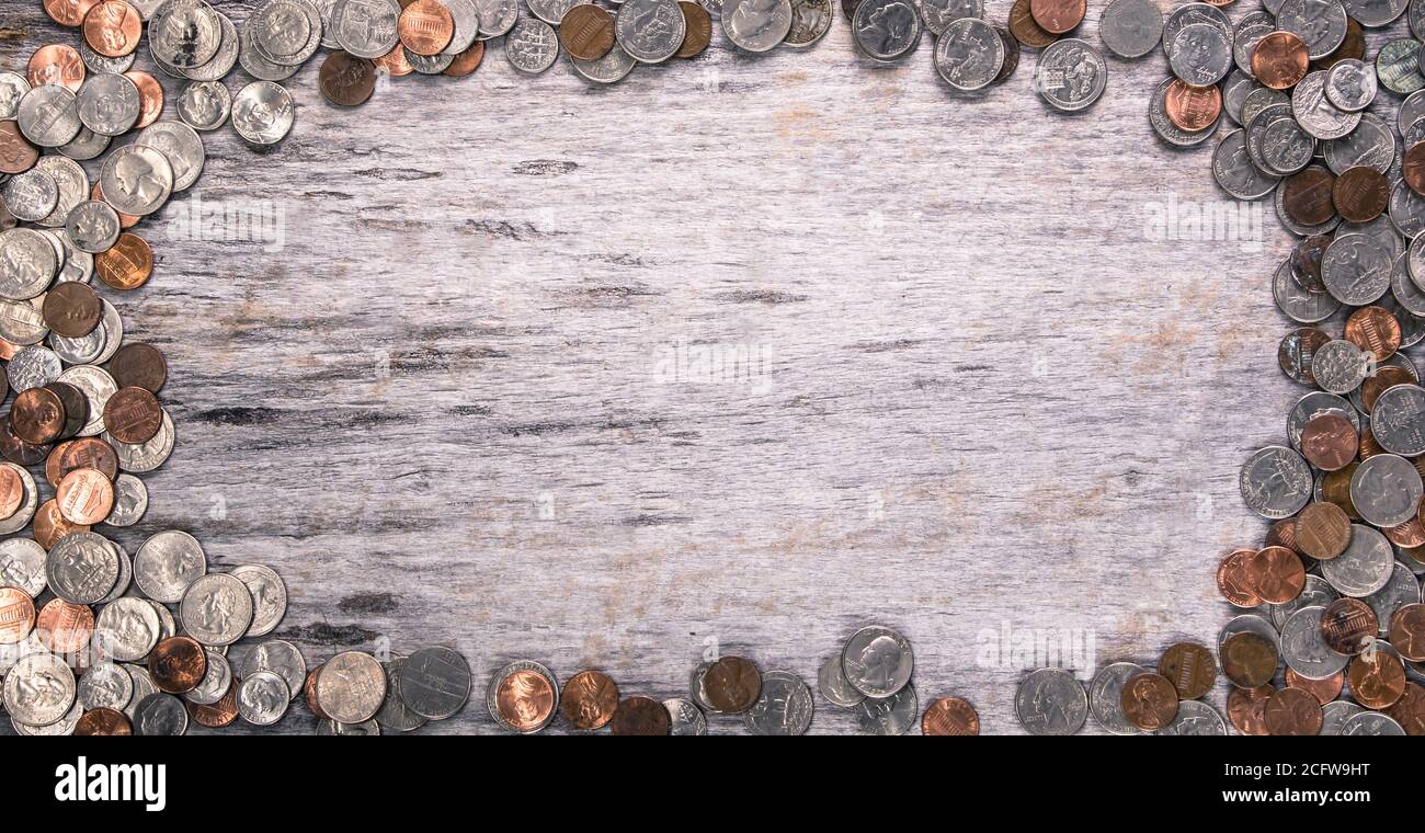 Old wood background with old coins scattered to form frame. Texture ...