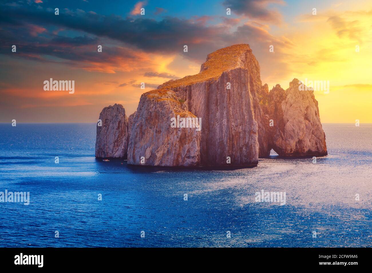 High cliffs of Mediterranean coast, "Pan di Zucchero" stack rock in ...