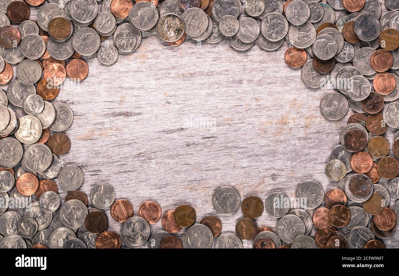 Old wood background with old coins scattered to form frame. Texture ...