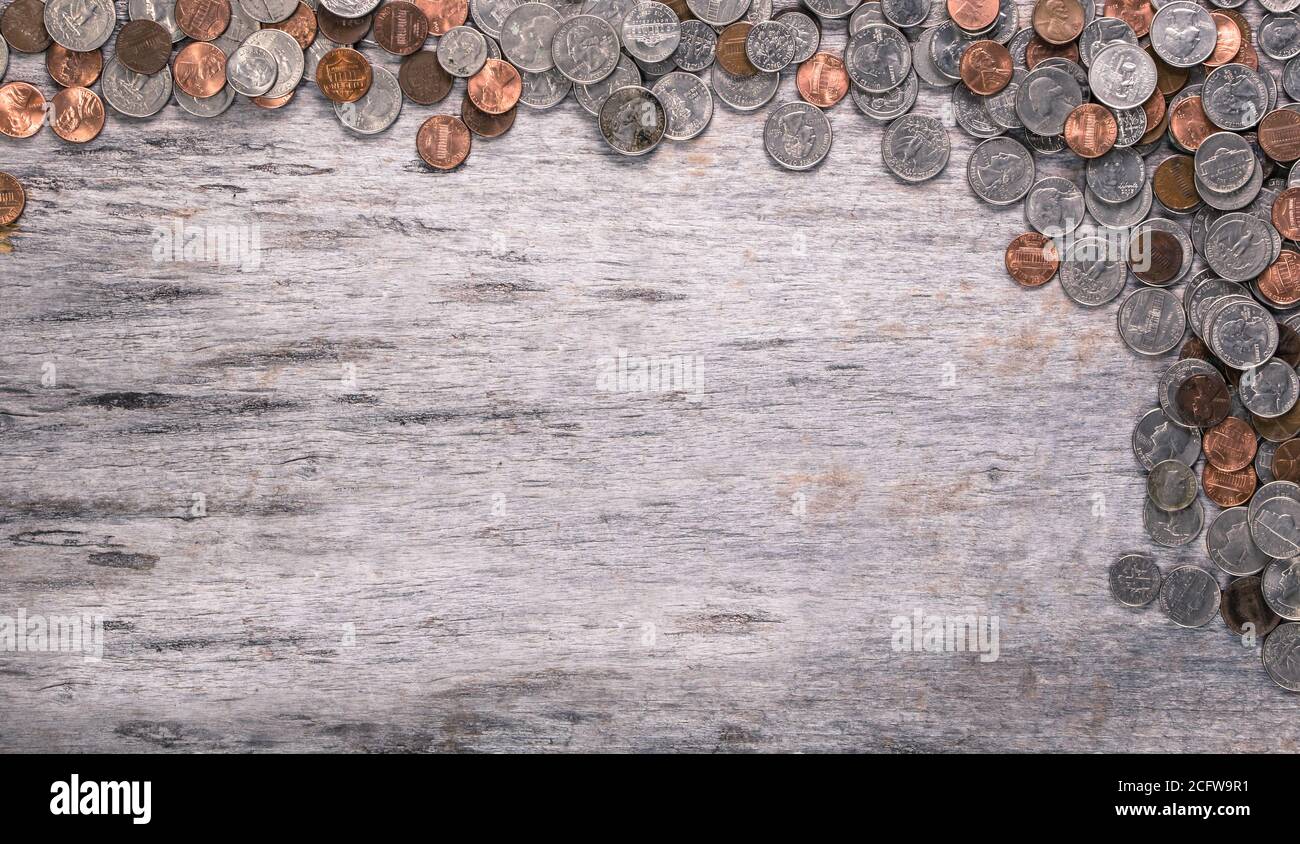 Old wood background with old coins scattered to form frame. Texture ...