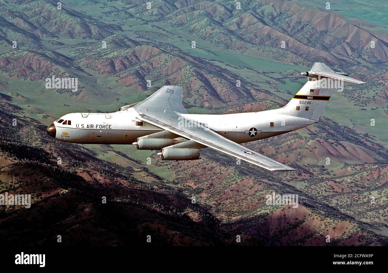1979 - An air-to-air left side view of a C-141 Starlifter aircraft from ...