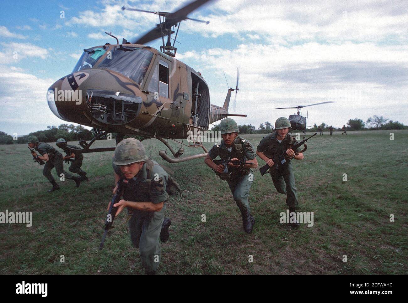1975 - Members of the 1st Cavalry Division deploy from UH-1 Iroquois ...