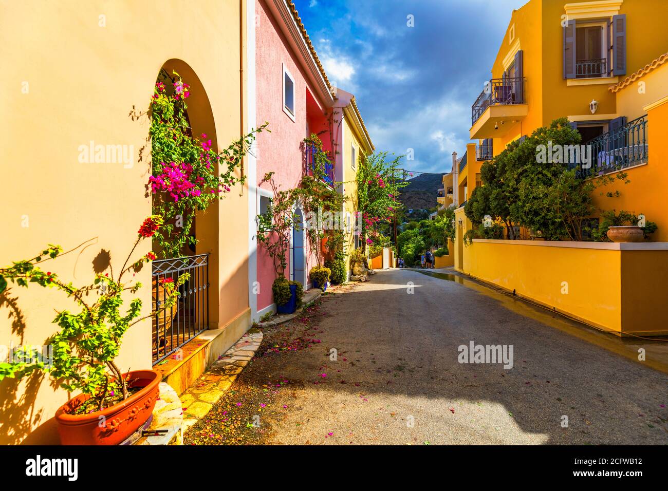 Traditional street with greek houses with flowers in Assos, Kefalonia ...