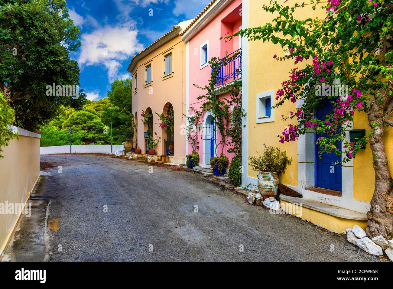 Traditional street with greek houses with flowers in Assos, Kefalonia ...