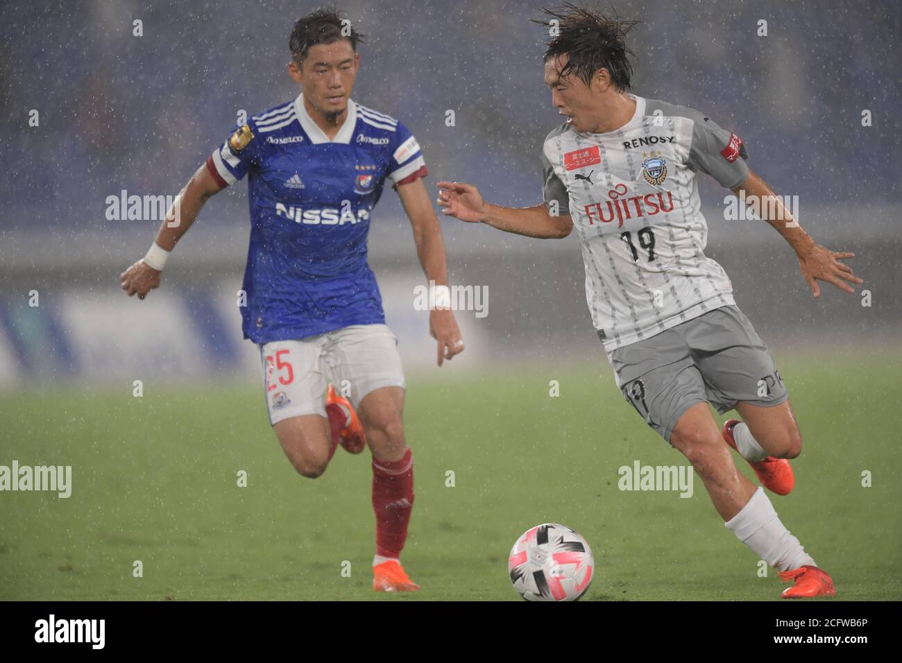 Manabu Saito (R) of Kawasaki Frontale and Ryuta Koike of Yokohama F. Marinos during the J.League ...