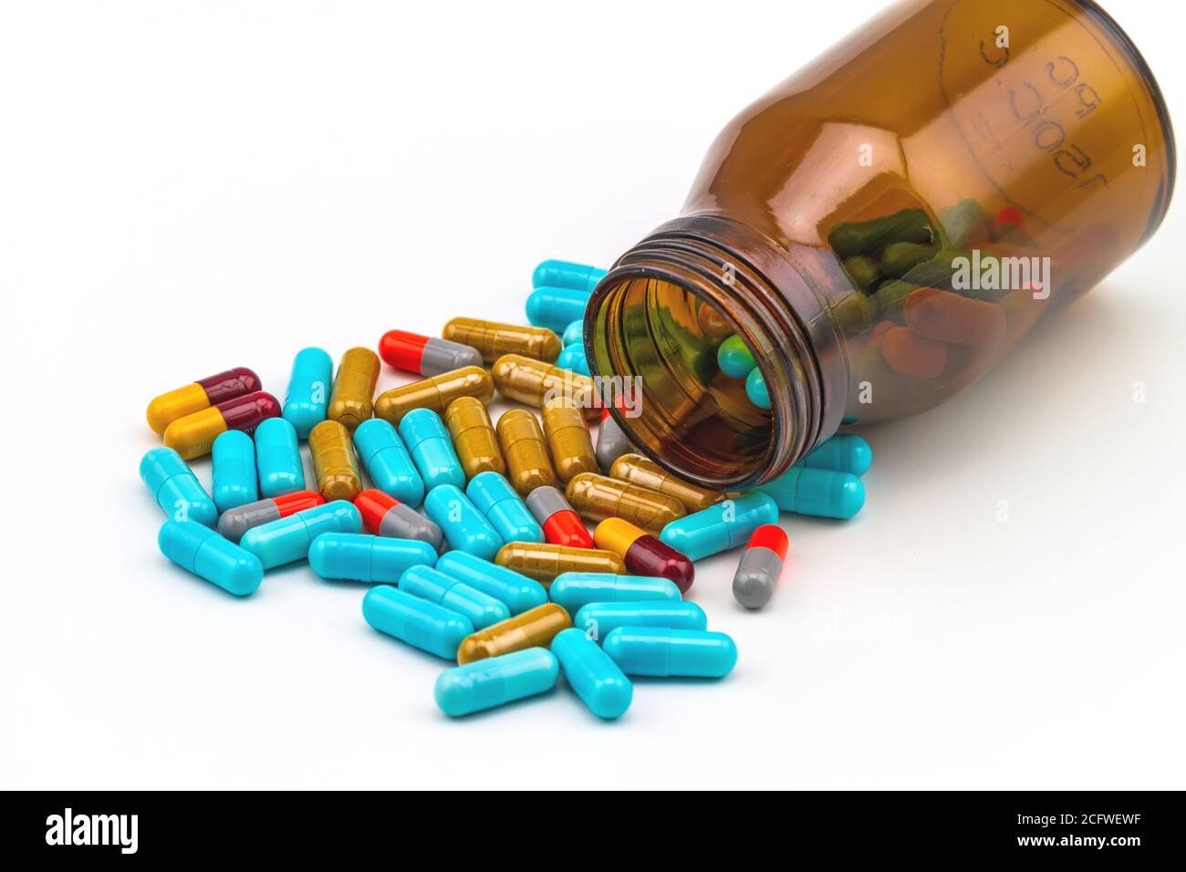 colorful pills and bottle tablets on white background Stock Photo - Alamy