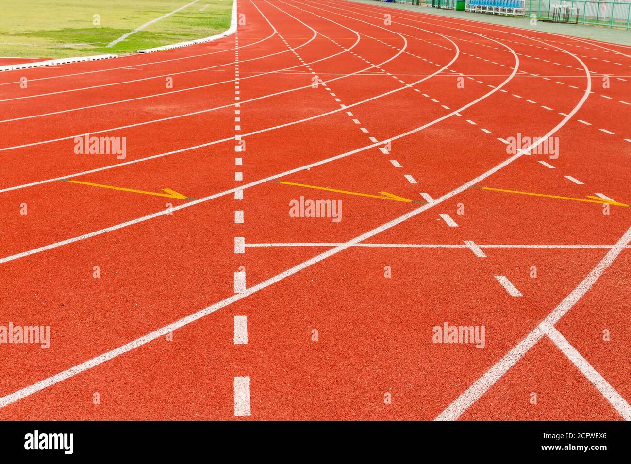 white dash line on red running track Stock Photo - Alamy