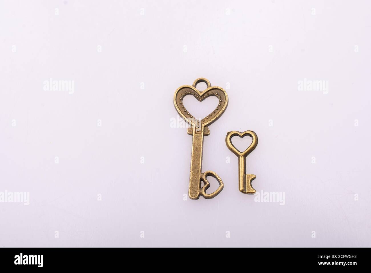 Heart shaped retro metal keys on white background Stock Photo - Alamy