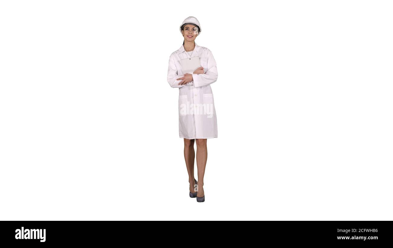 Female doctor engineer walking with digital tablet on white background ...