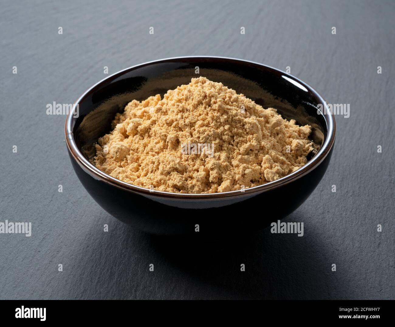 Japanese soybean flour on a black background, taken from an angle Stock ...