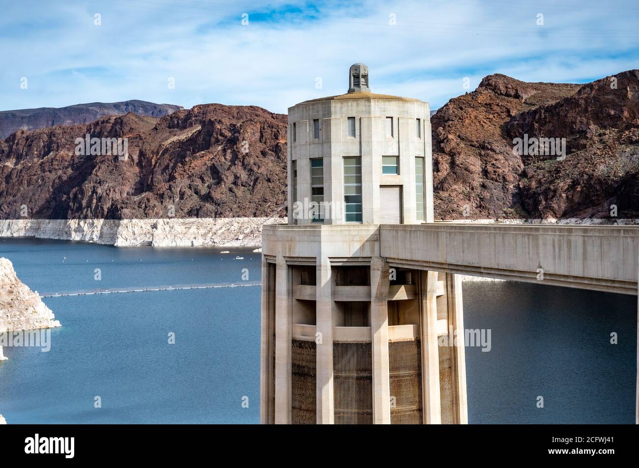 Industrial water intake structure on hydro dam. Concrete supports ...