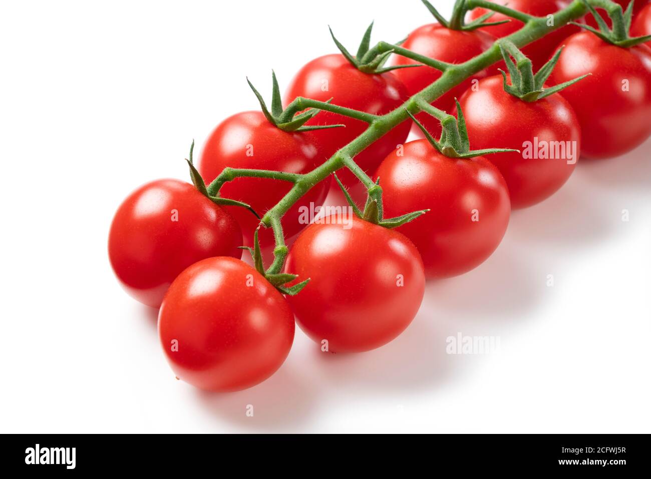 A series of fresh petite tomatoes on a white background Stock Photo - Alamy