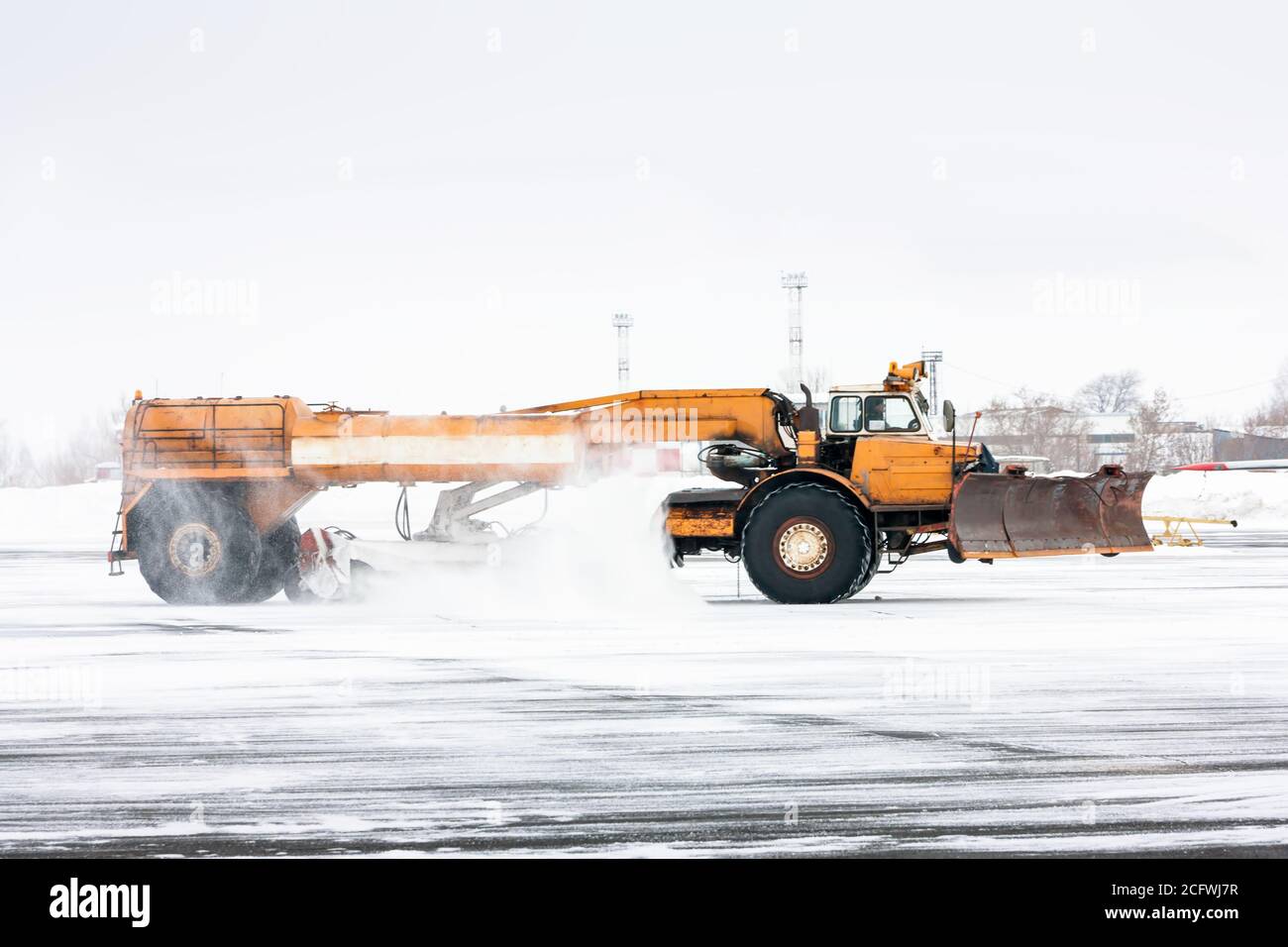 Airfield sweeper cleans the Runway Stock Photo - Alamy