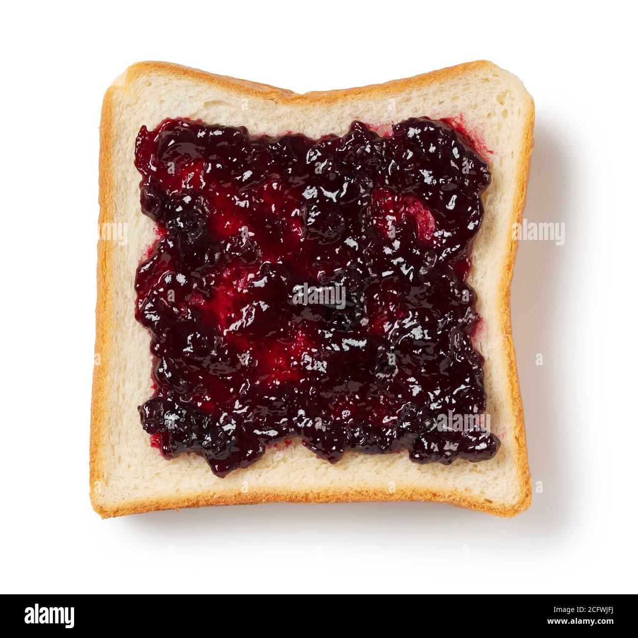 A bird's-eye view of the blueberry jam-dusted bread set against a white ...