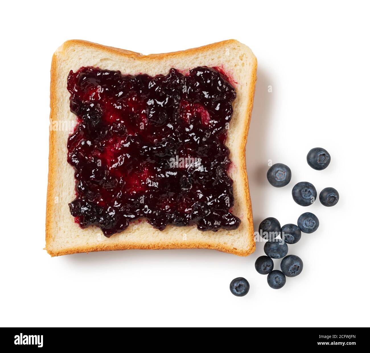 A bird's-eye view of blueberry jam-stained bread and blueberry berries ...