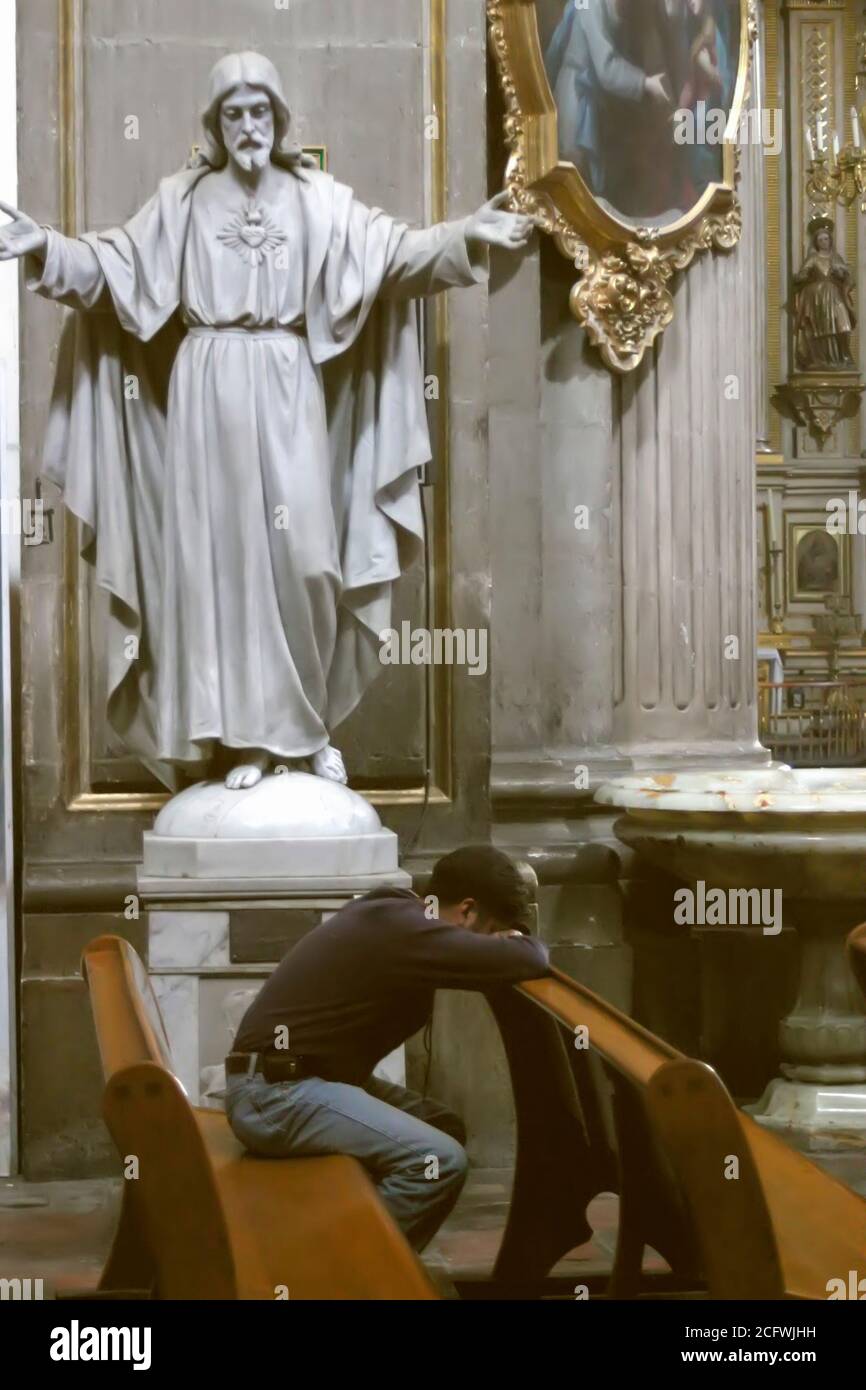 Inside church people praying hi-res stock photography and images - Alamy