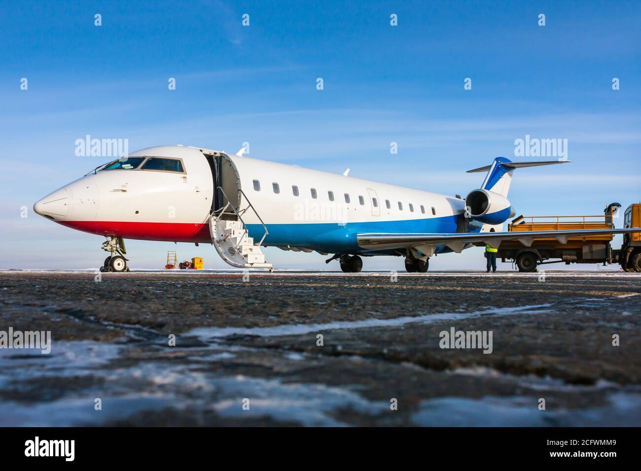 Ground handling of private airplane in a cold winter airport Stock ...