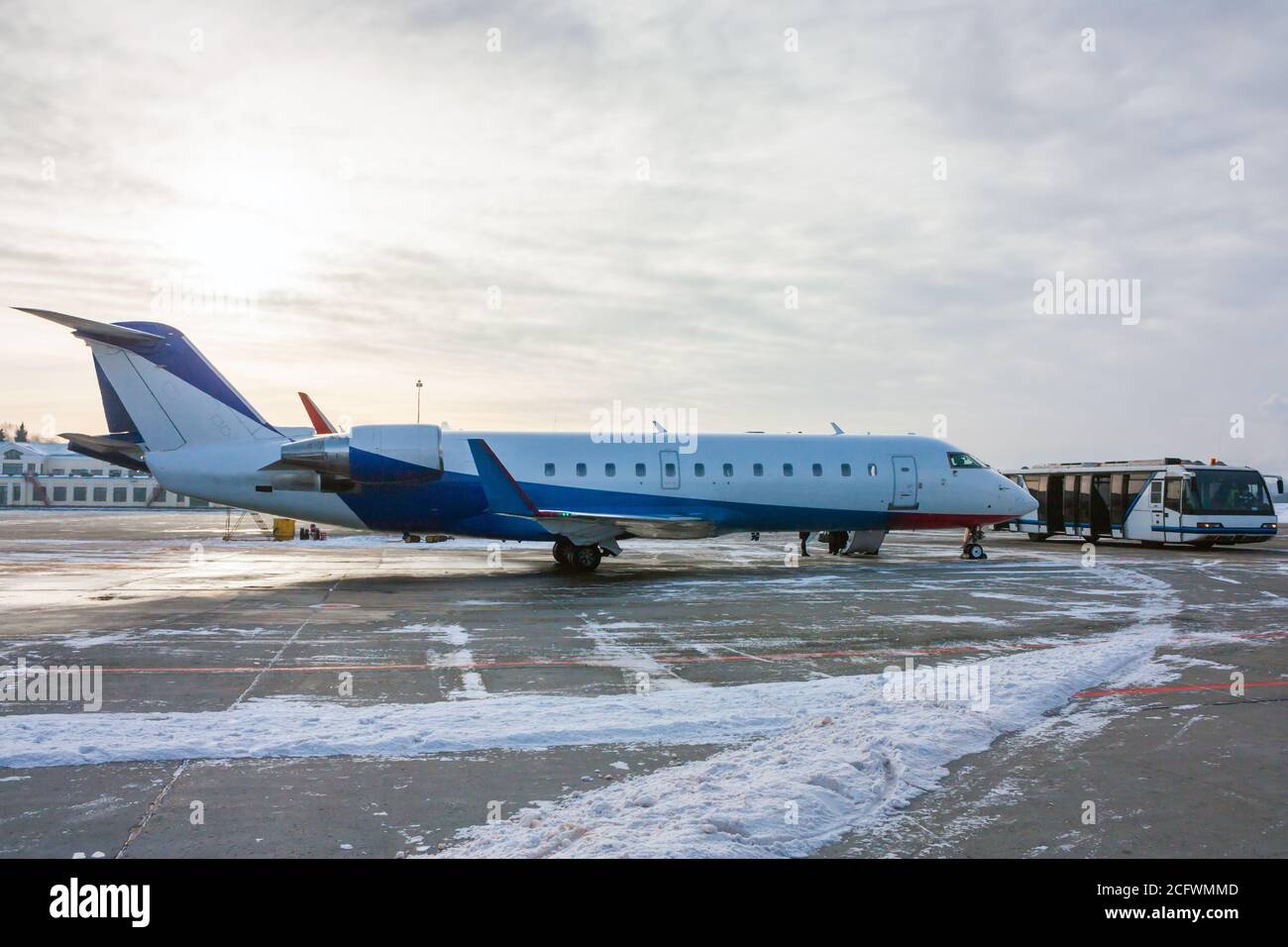 Private aircraft and apron bus Stock Photo - Alamy
