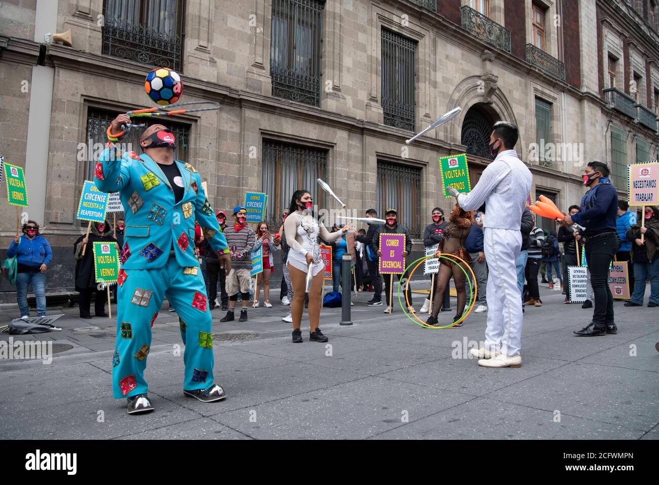 MEXICO CITY, MEXICO - AUGUST 25: A Circus worker juggles while take ...