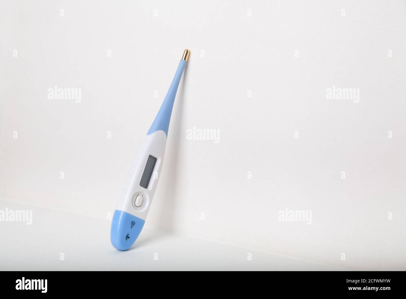 Side view of electronic thermometer against white background Stock ...
